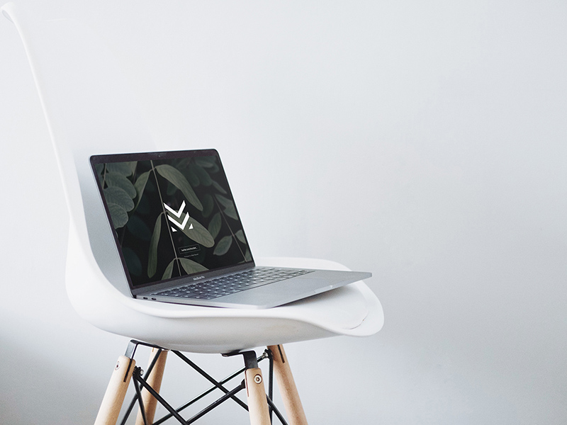 MacBook Mockup On Chair by Mocklet - Freebie Supply